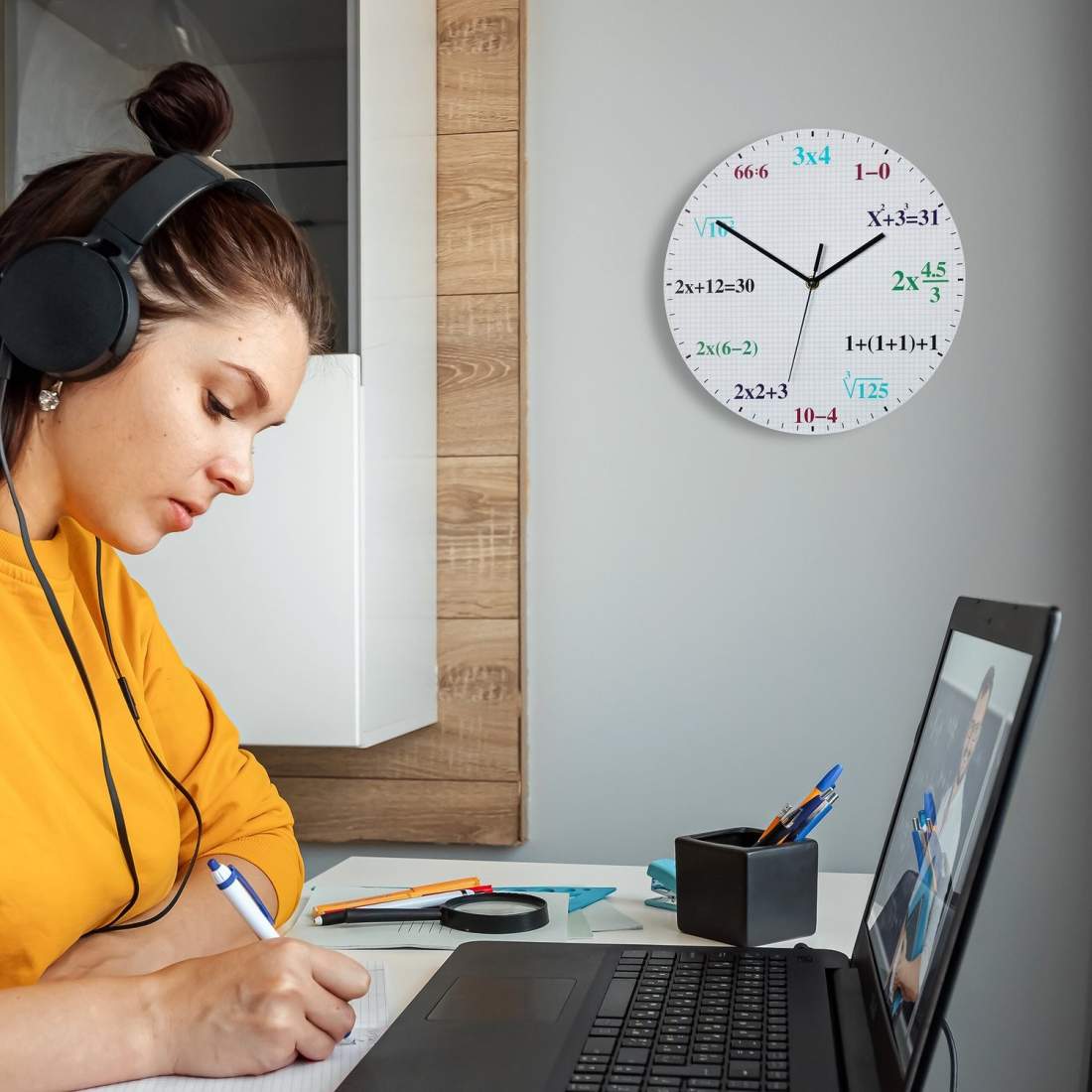 Wall clock with mathematical formulas